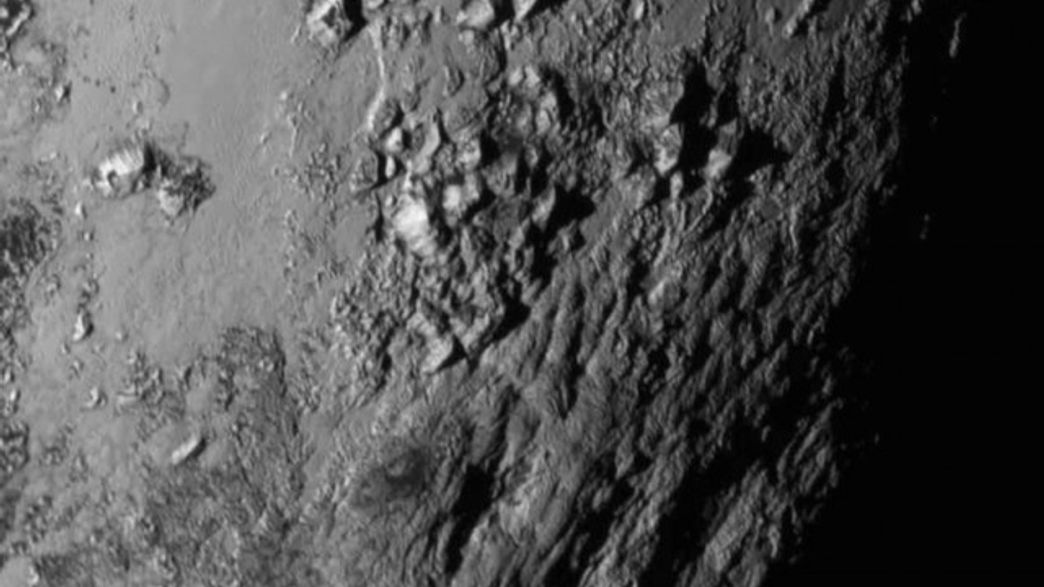 First Close-Up Photograph Of Pluto's Surface Released | IFLScience