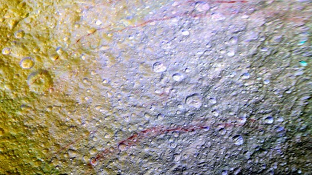 Strange Red Streaks Spotted On Tethys | IFLScience