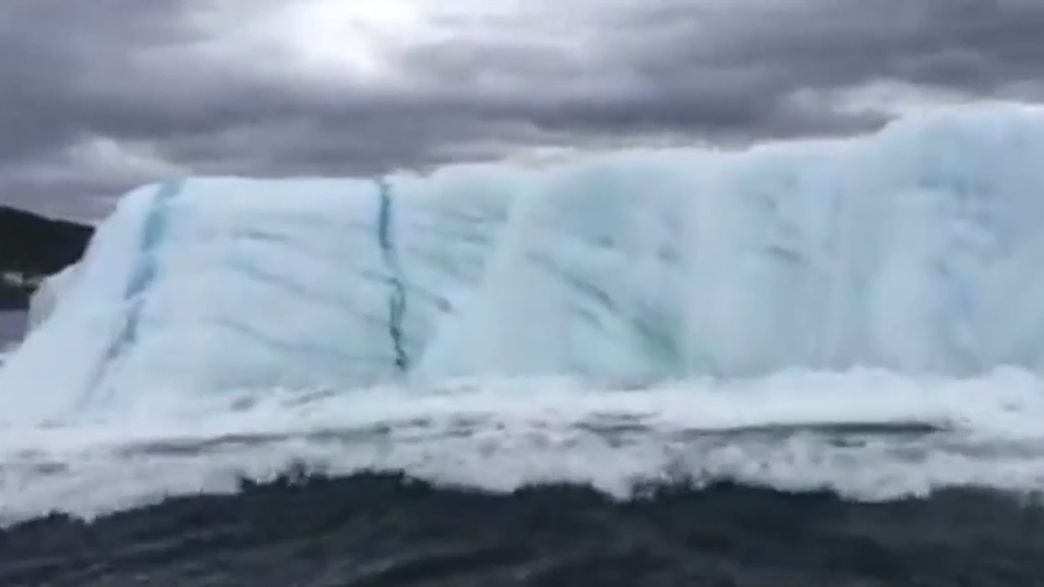 Video Captures Moment Giant Iceberg Completely Flips Over | IFLScience